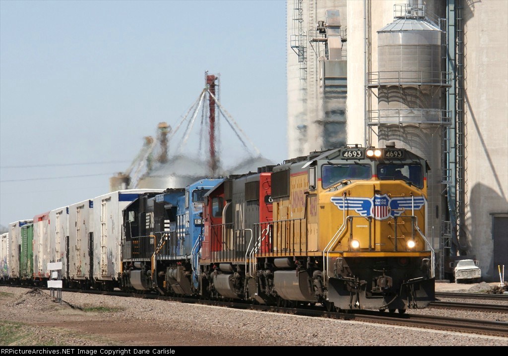 UP 4693 is seen leading a colorful consist east.
